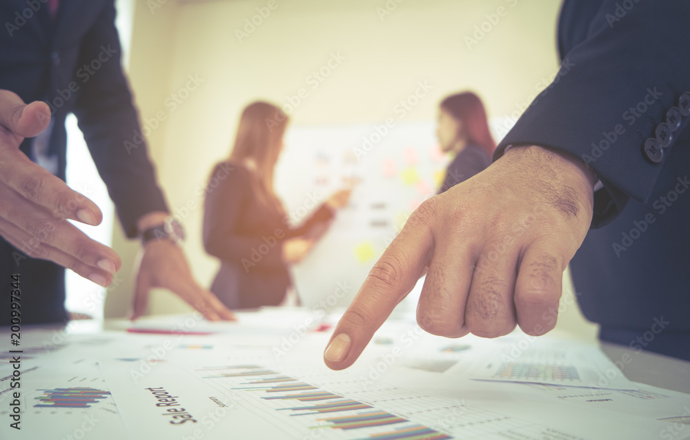 Hands pointing on data chart sheet for business meeting Stock Photo ...