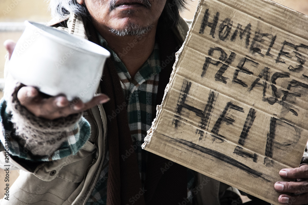 Lifestyle Homeless man on walkway street in capital city. Stock Photo ...