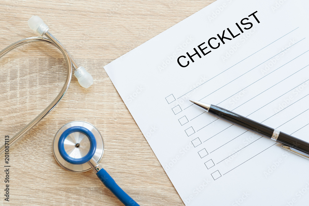 Hands writing checklist with annual health and stethoscope - to do list ...