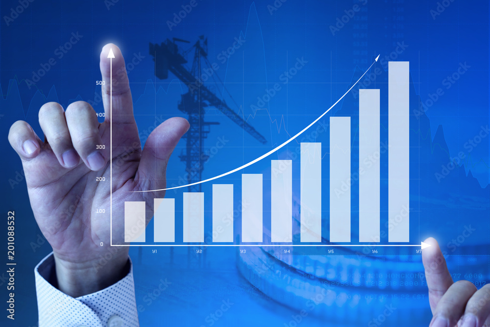 Close up of a businessman’s hands expanding an exponential line curve ...