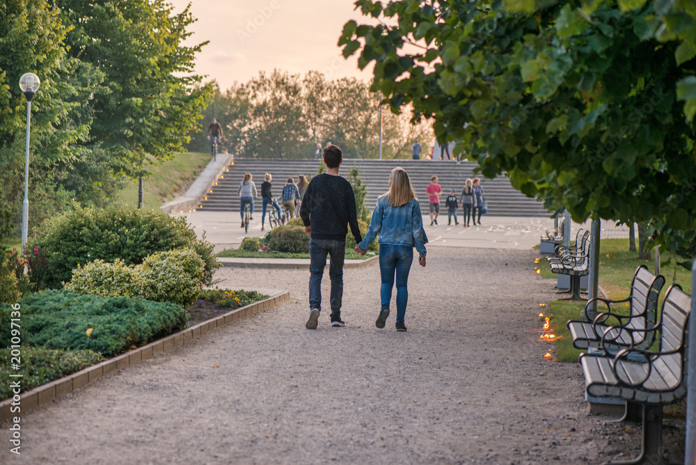 People Walking In Park At Night