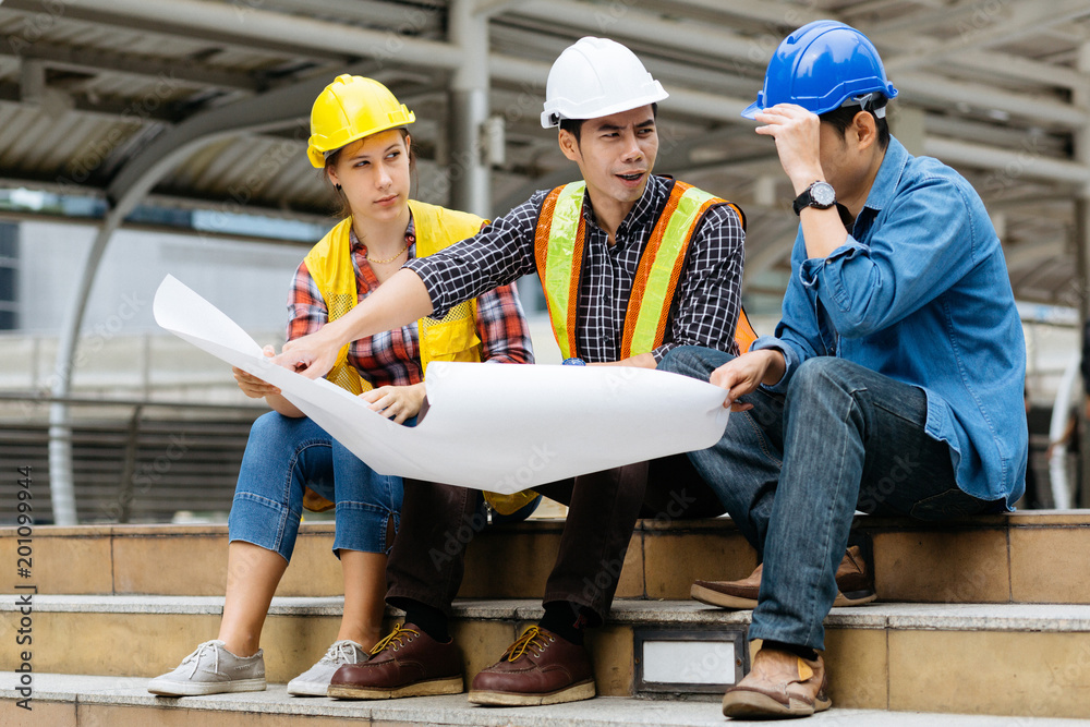 Engineer team meeting outdoor using blueprint Stock Photo | Adobe Stock