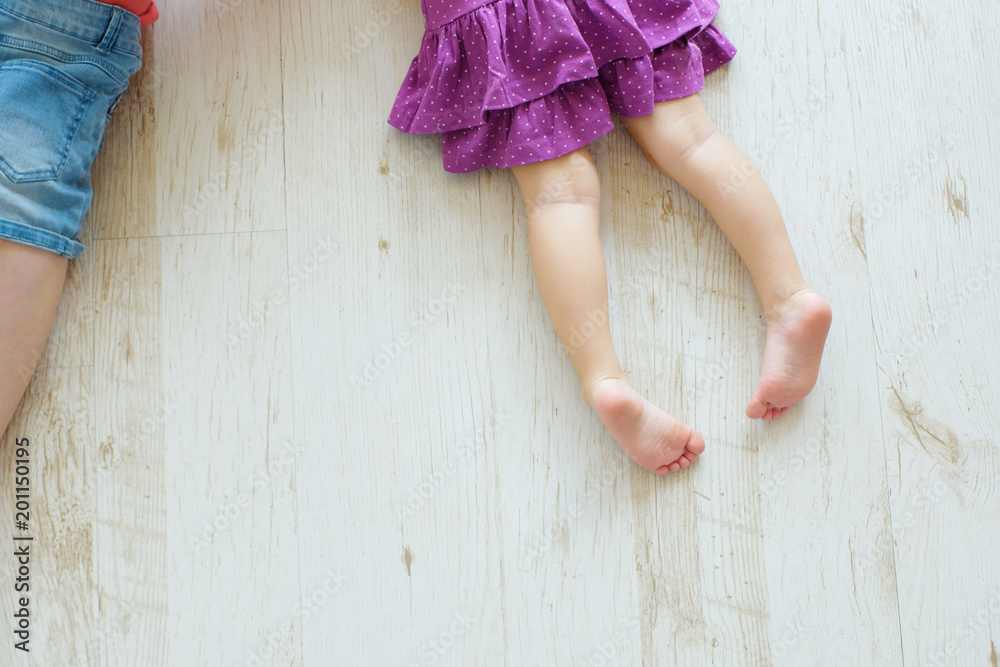 The child's legs on a floor. Top view. Nurseries of a foot. Stock Photo ...