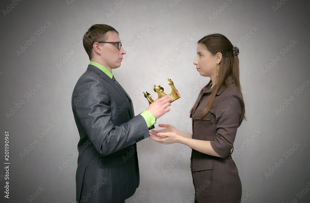 The businessman holds the gold crown as symbol of power and giving it ...