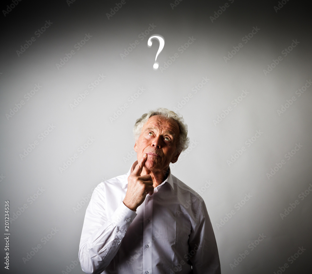 Old man in white and question mark. Stock Photo | Adobe Stock