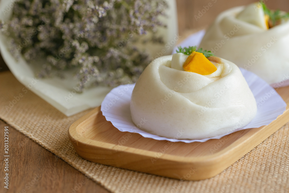 Chinese white steamed bun known as Dim Sum or salapao filled with ...