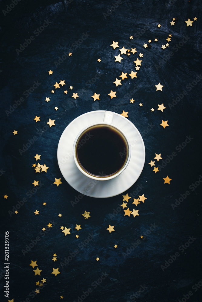 Cup of coffee and stars on a dark blue background. Concept of the ...