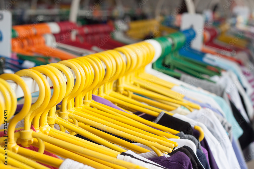 Clothing rack. Hangers in the clothes store. Shallow dof Stock Photo ...