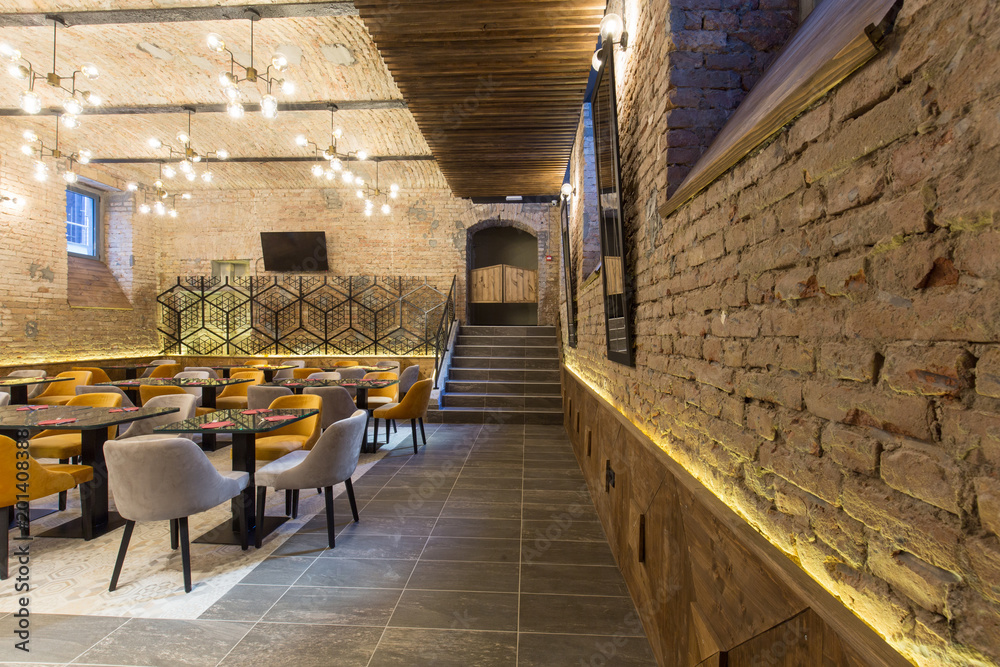 Interior of a modern hotel restaurant with brick wall Stock Photo ...