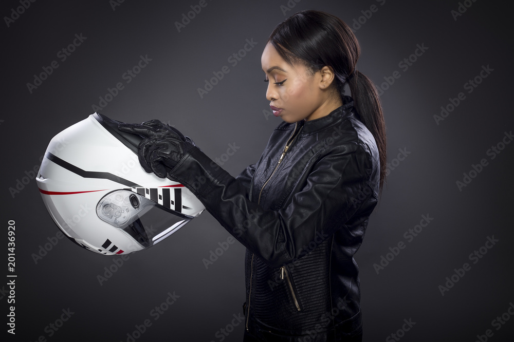 Black female motorcycle rider or race car driver wearing a racing ...