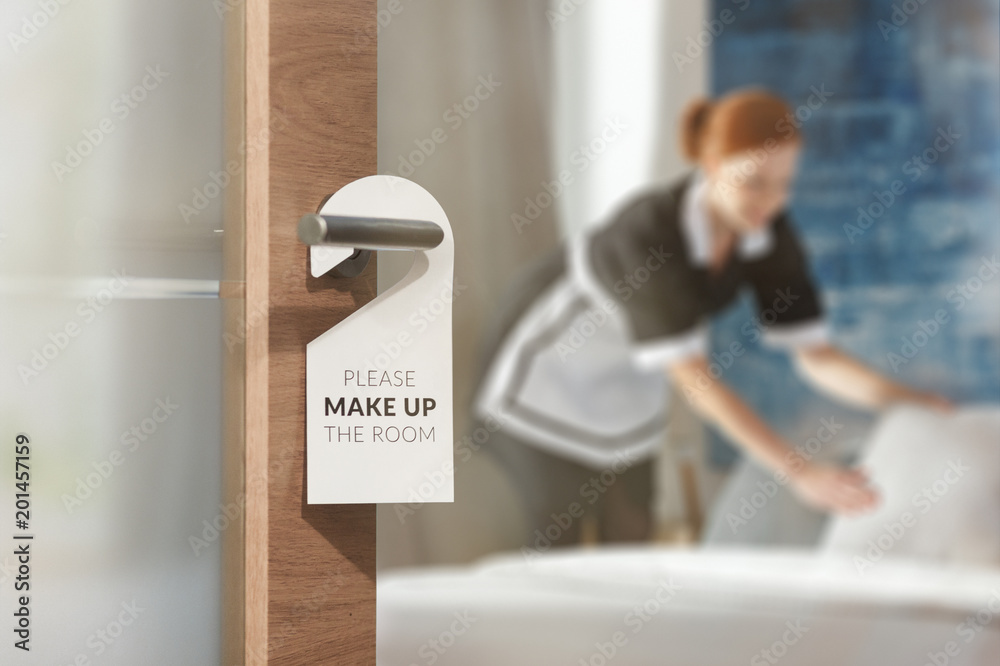 Housemaid cleaning up room Stock Photo | Adobe Stock