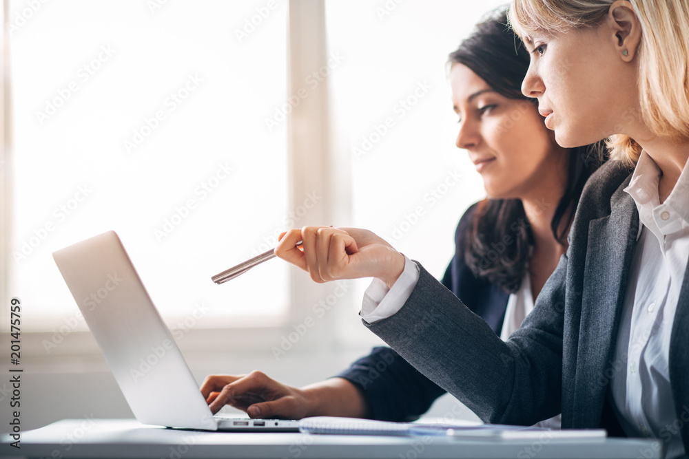 Colleagues working in office Stock Photo | Adobe Stock
