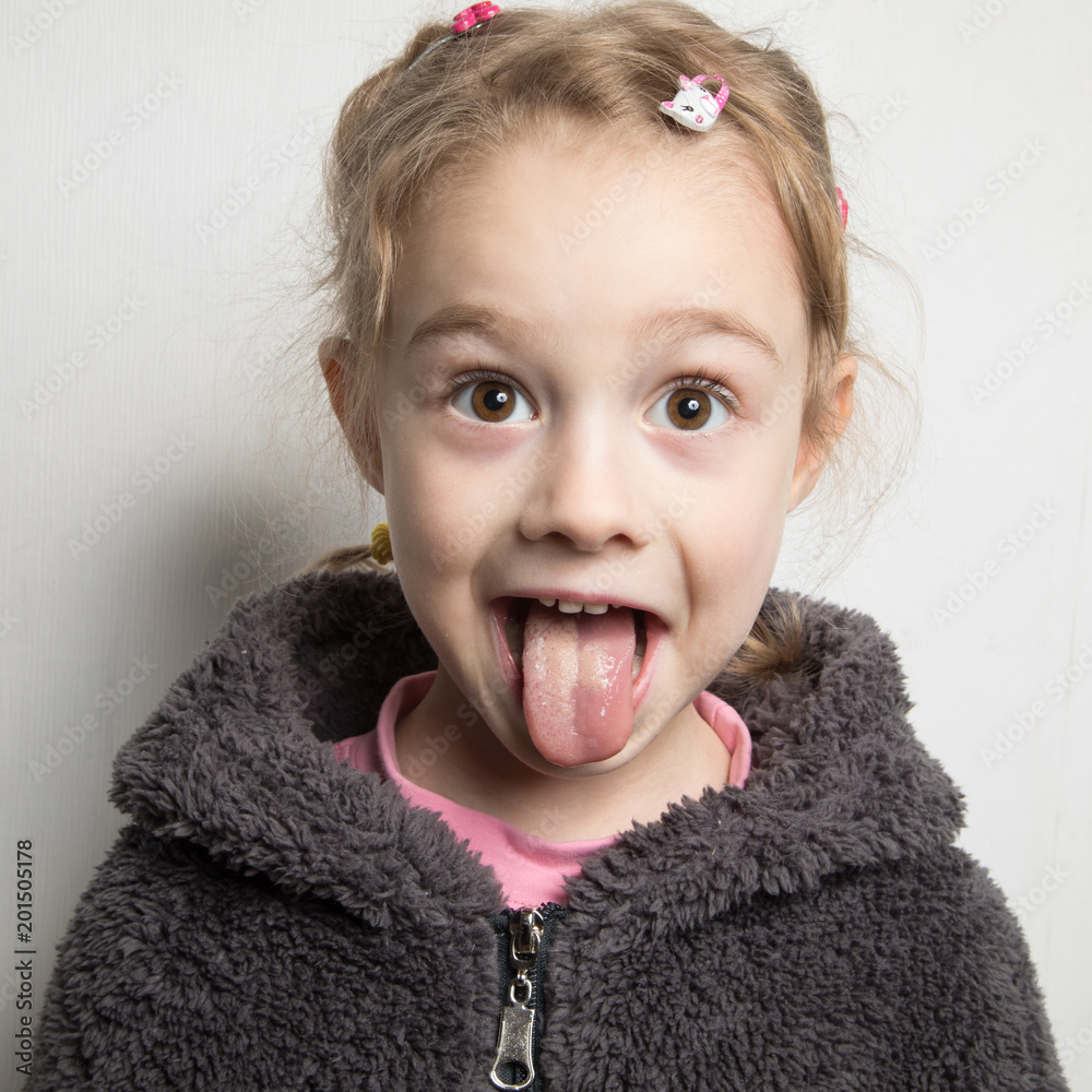 Happy Little Girl Showing Her Tongue Stock Photo Adobe Stock