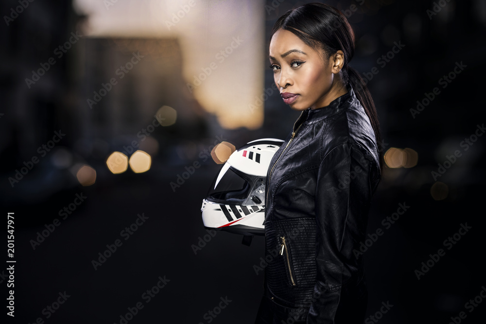 Black female motorcycle rider or race car driver wearing a racing ...