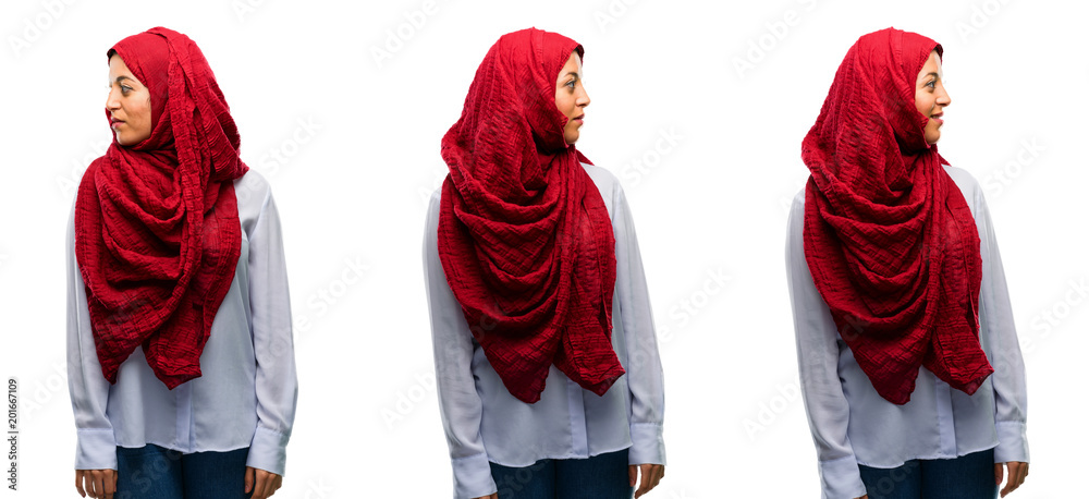 Arab woman wearing hijab side view portrait isolated over white ...