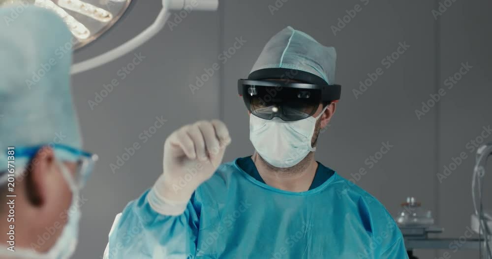 CU Portrait of surgeon using augmented reality holographic hololens ...