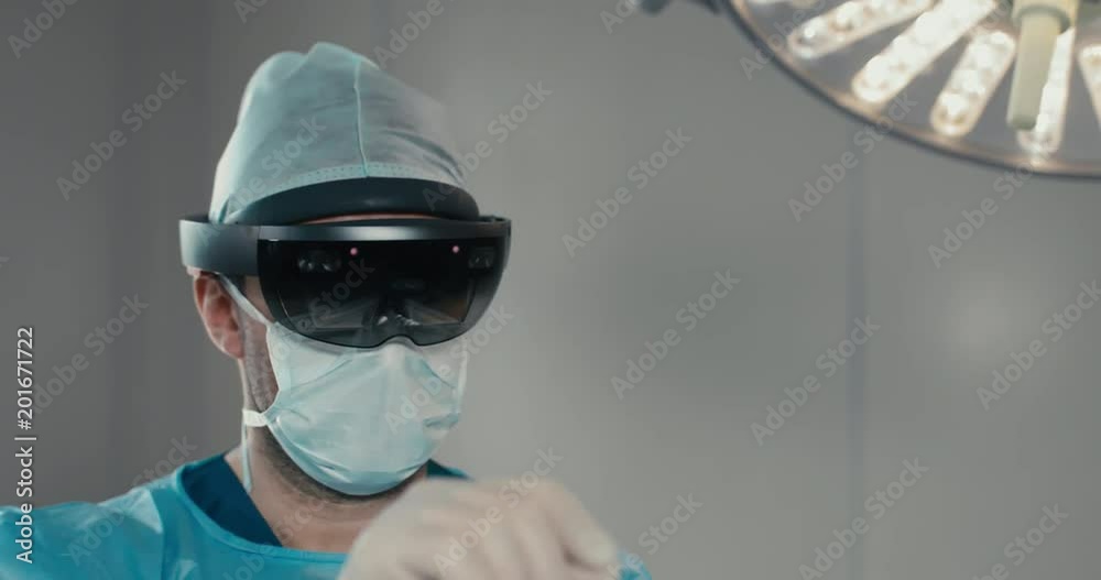 CU Portrait of surgeon using augmented reality holographic hololens ...