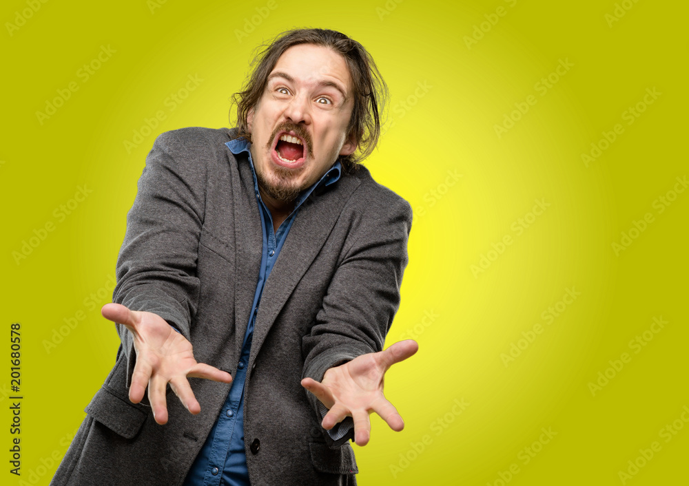 Handsome young man terrified and nervous expressing anxiety and panic ...