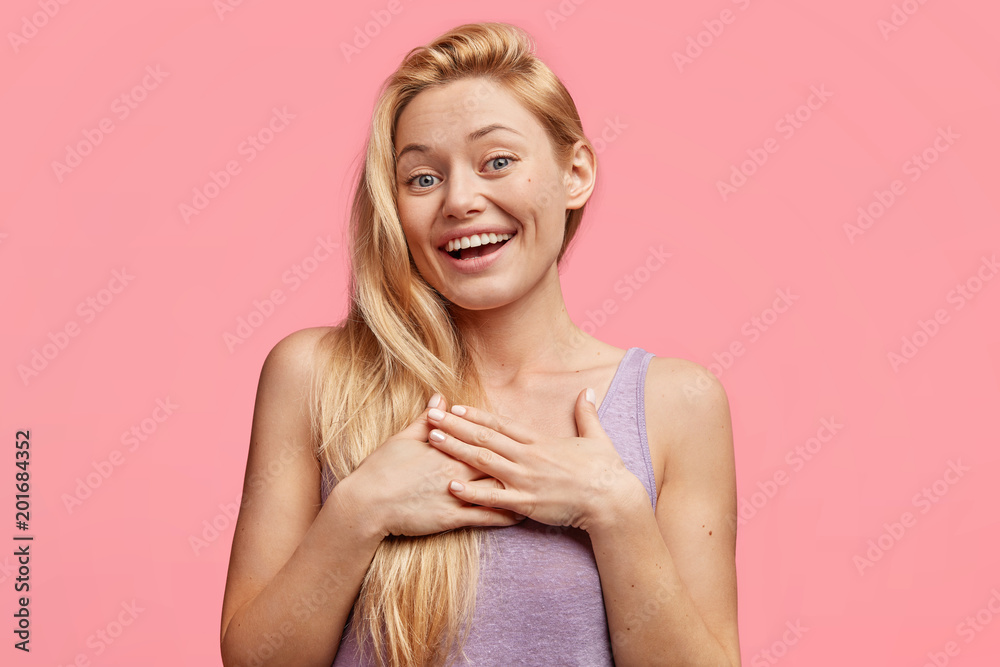 Happy blonde woman being touched and glad to recieve congratulations ...