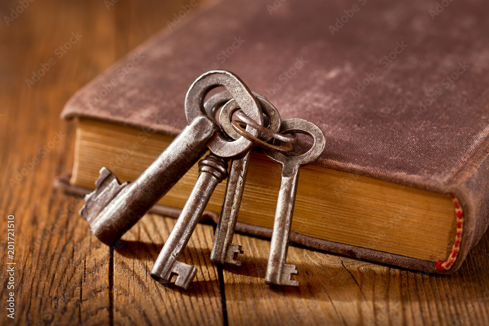 still life with old keys on a book Stock Photo | Adobe Stock