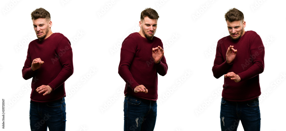 Handsome blond man disgusted and angry, keeping hands in stop gesture ...