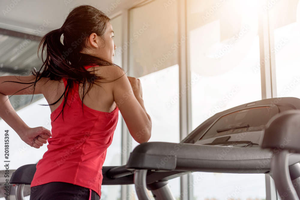 Exercise treadmill cardio running workout at fitness gym of woman ...