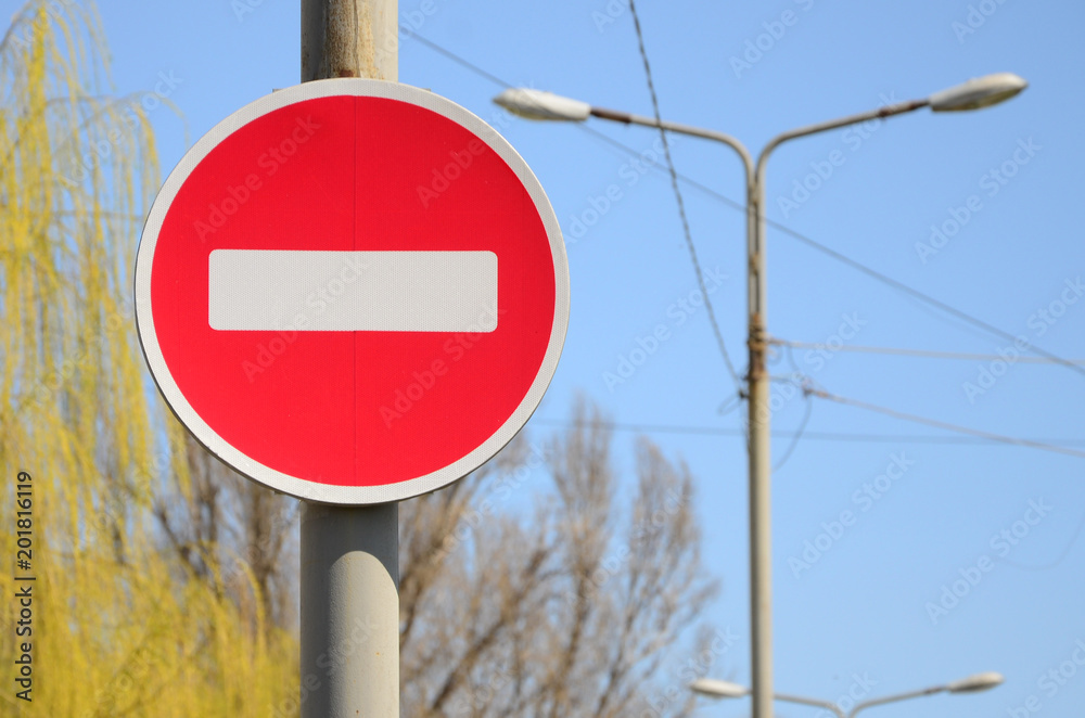 Road sign in the form of a white rectangle in a red circle. No entry ...