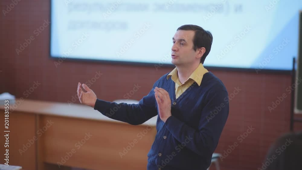 Teacher at the university gives a lecture. Male professor is teaching ...