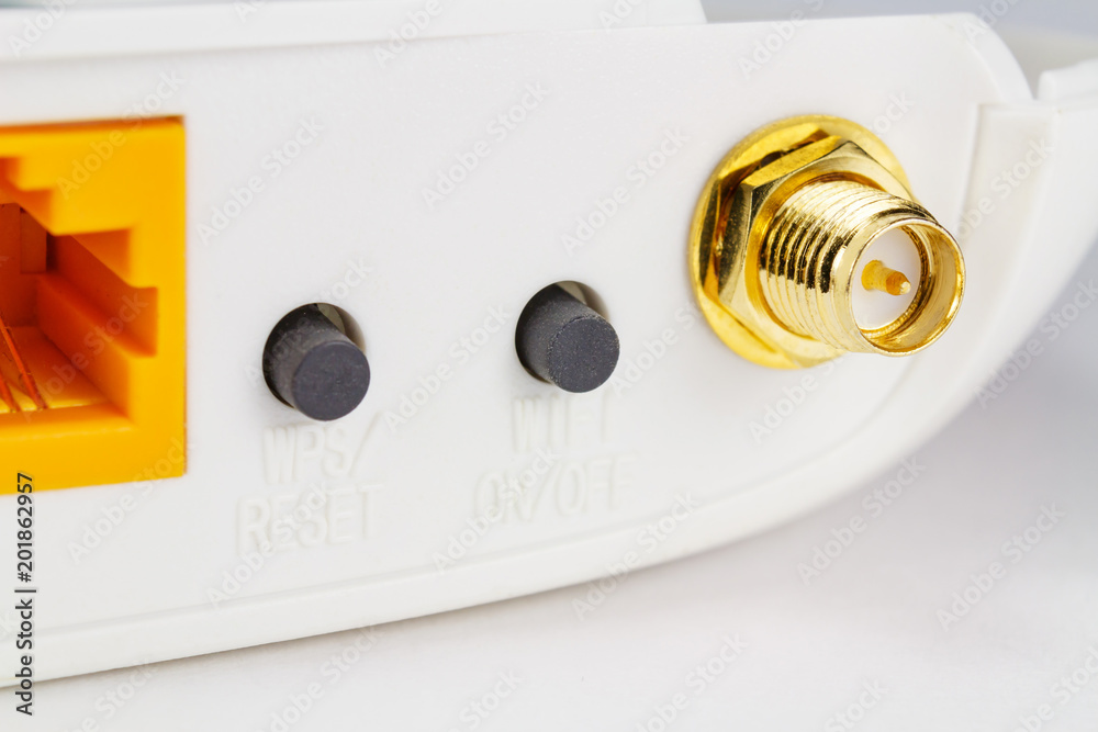 Antenna connector and control buttons on the back panel of the router ...