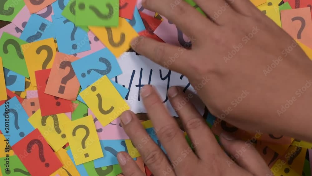 Video Stock hand searching for why note. colorful paper note with ...