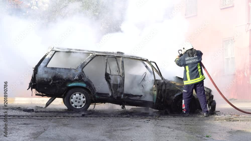 car explosion. car on fire. burning car crash accident. firefighter ...