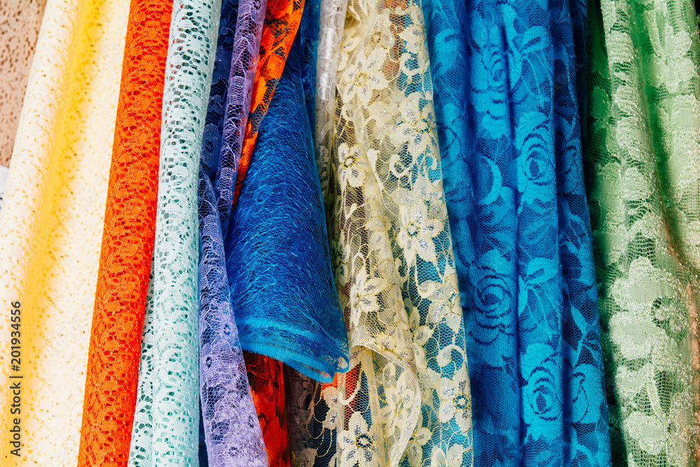 Different types of fabrics are stacked in a row Stock Photo | Adobe Stock