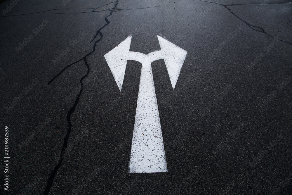 Dark asphalt City asphalt road with two way arrow sign background.with ...
