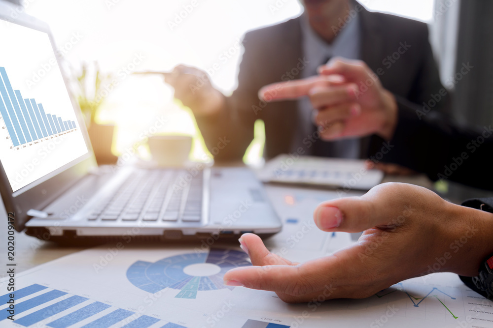 Business people partner negotiating a contract, they are pointing on a ...