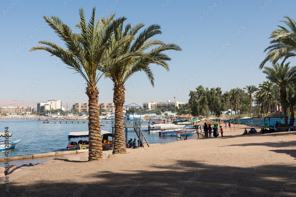 Touristic ships on the beach of Aqaba, Jordan. Popular resort, located ...