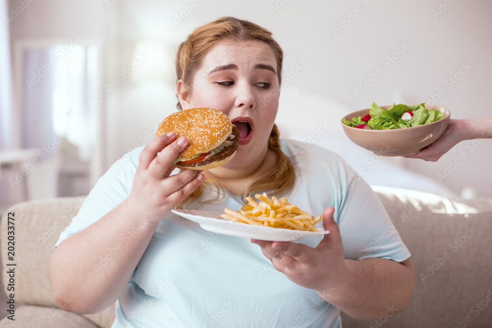 Junk Food Fat Young Woman Eating Unhealthy Food While Thinking About Junk Food Fat Young Woman Eating Unhealthy Food While Thinking About