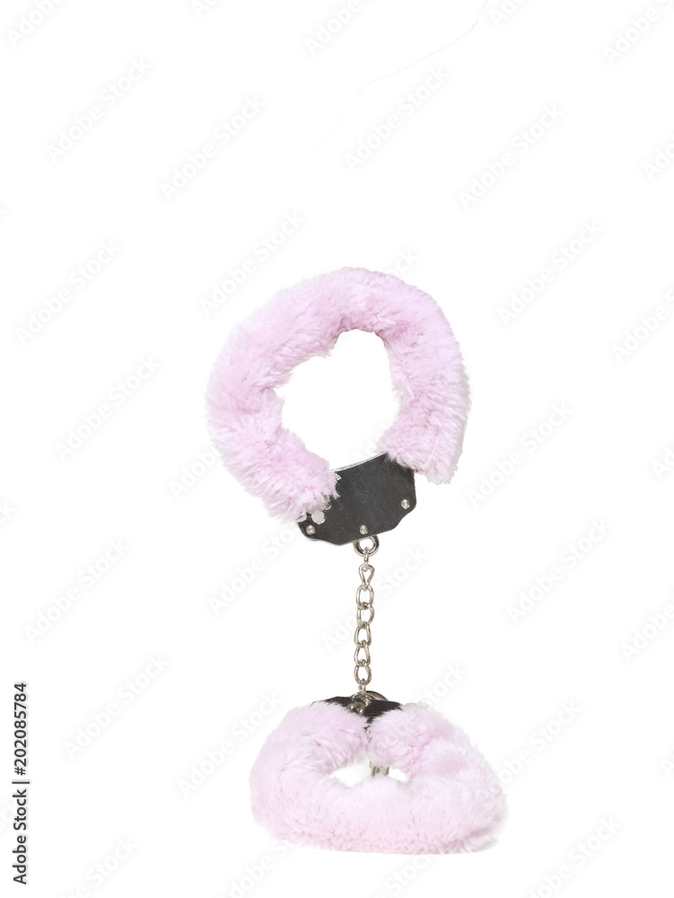 Fluffy pink handcuffs on white background Stock Photo | Adobe Stock