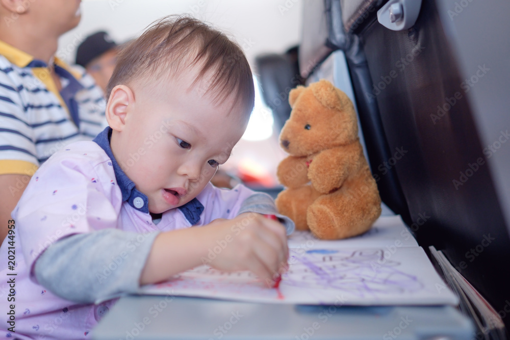Boy Coloring With Crayons