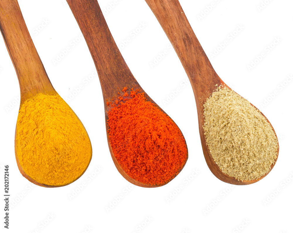 Indian Spices in Wooden Spoons Also Know as Red Chilli Powder, Turmeric ...