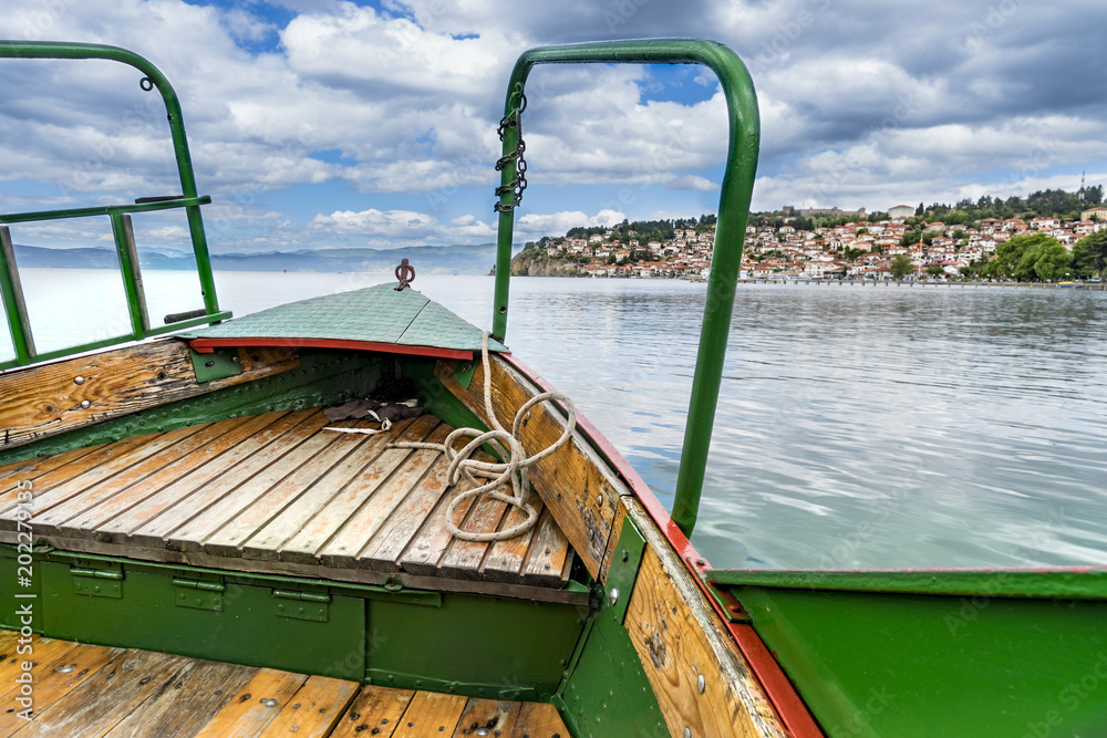 Ohrid lake. Fishing boat personal perspective with the view of an old ...