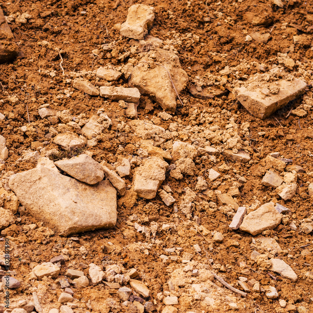 Ground background with natural light. Clay in the form of lumps and ...