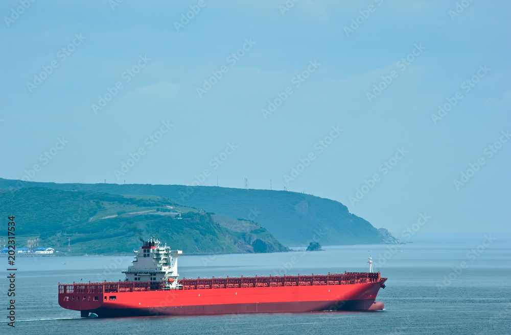 Empty container ship moving by sea. Stock Photo | Adobe Stock