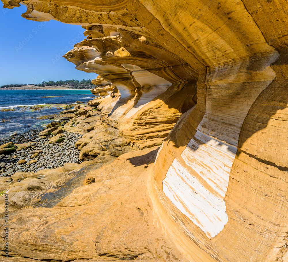 Amazing coast line called Painted Cliffs with orange yellow colored ...