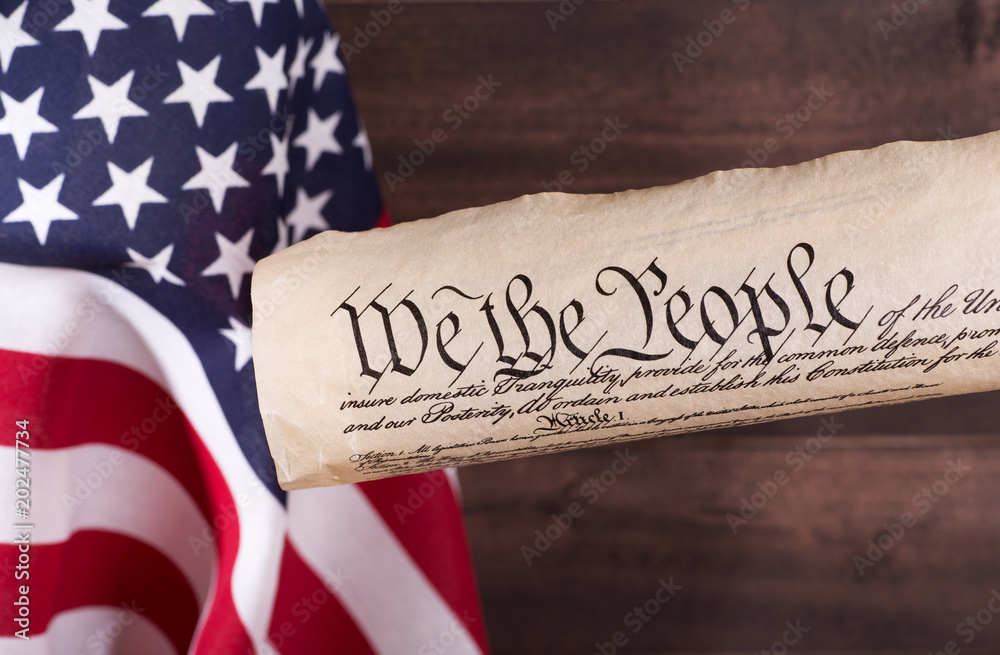Preamble to the United States constitution with the American flag in ...