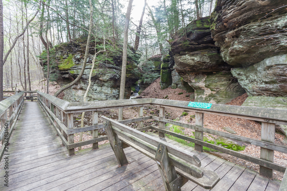 Poster A nature viewing boardwalk at Ansel's Cave, which is a rock ...