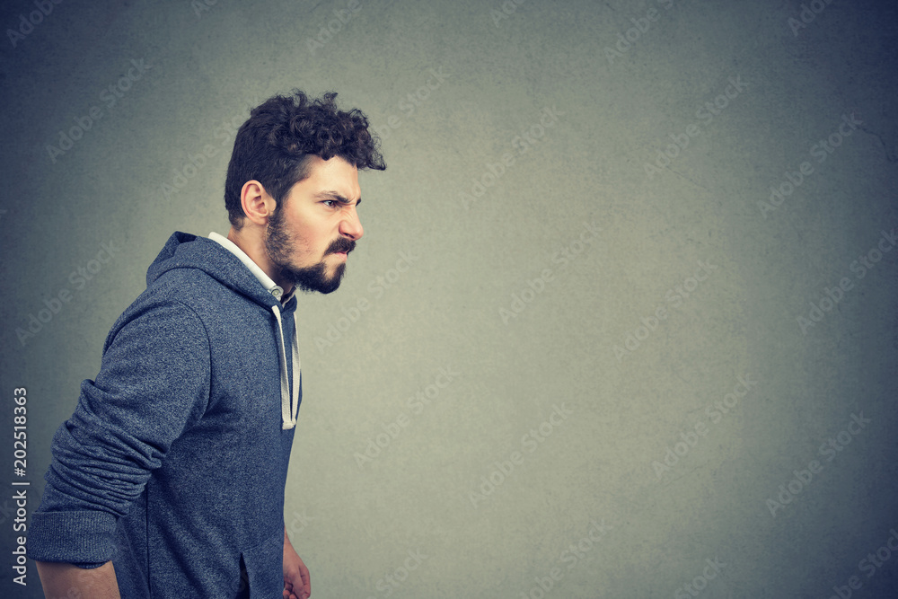 Angry annoyed man with hateful face expression Stock Photo | Adobe Stock