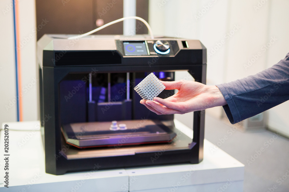 The engineer demonstrates the structure printed on a 3d printer Stock ...
