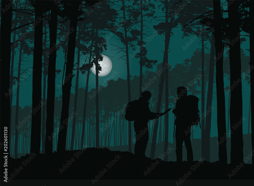 Two tourists, man and woman wandering the night forest with map, under ...