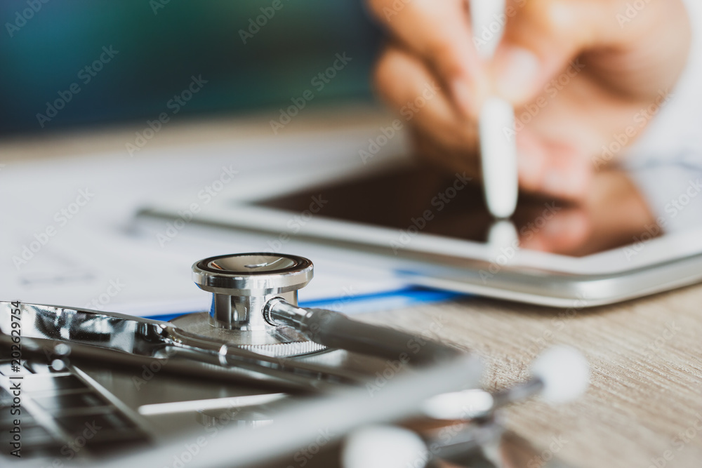 Healthcare medical concept, Blur Doctor's writing and working by stylus ...