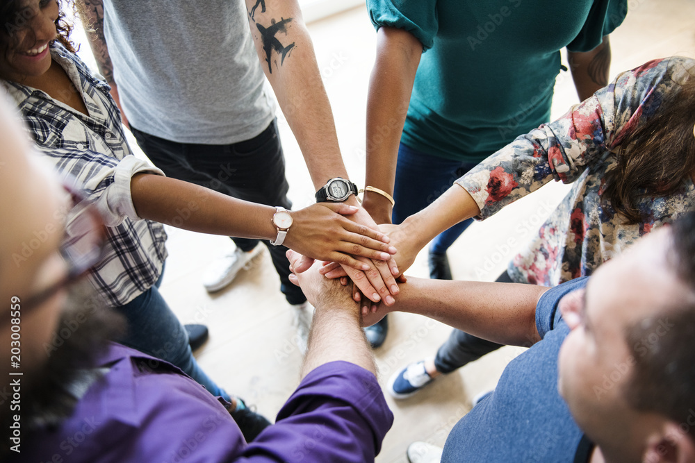 Group of diverse people joined hands together teamwork Stock Photo ...